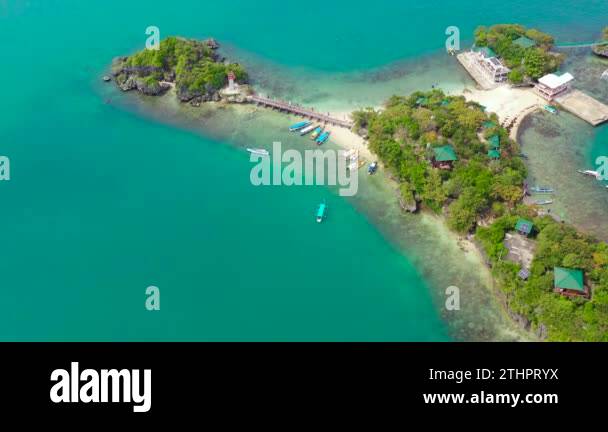 Tropical island with a sandy beach top view. Quezon Island Beach ...