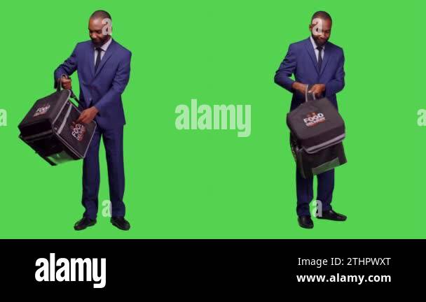 Corporate employee working as deliveryman in studio, having backpack to ...