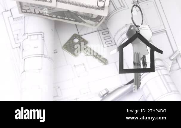 Animation of hanging house keys against spinning architectural drawings ...