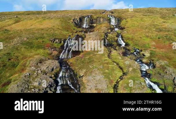 Aerial shot of two beautiful small waterfalls in the middle of two ...