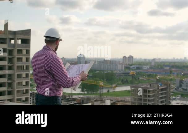 architect looking on project, turns off drawings Stock Video Footage ...