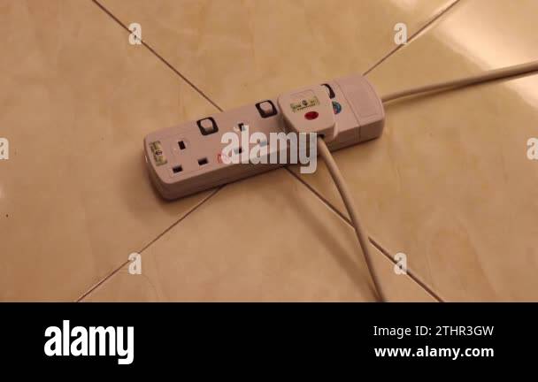 unplugging plug from socket from extension cord - medium Stock Video ...