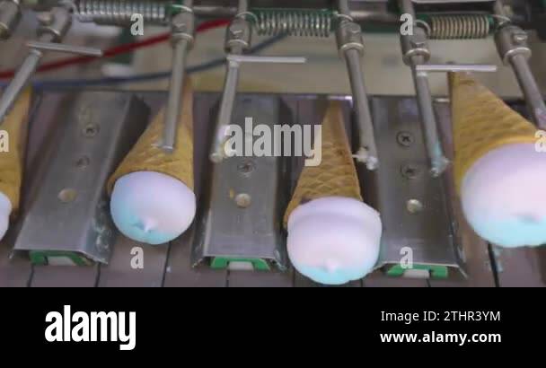 Ice cream on the conveyor line. Ice cream cone on the conveyor ...
