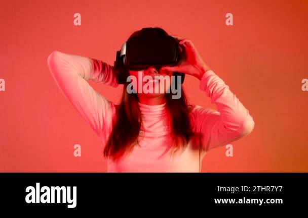 Metaverse concept, young asian woman in white shirt wearing vr headset ...