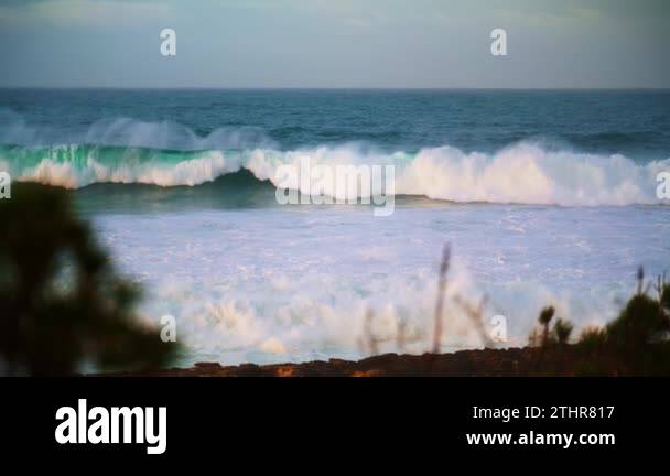 Powerful white waves rolling towards tropical coastline. Foamy ocean ...