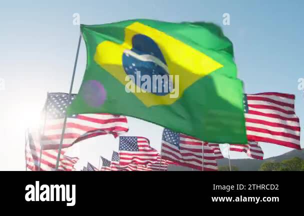 Flag of Brazil waving in wind with many American flags on motion ...