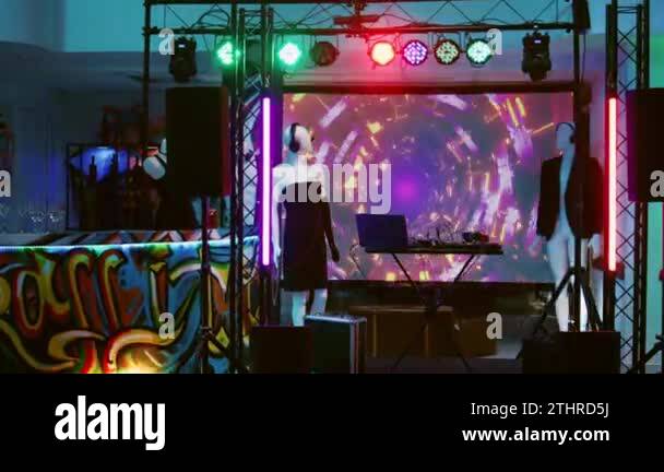Club with mixing station and lights, audio sound panel on stage used ...