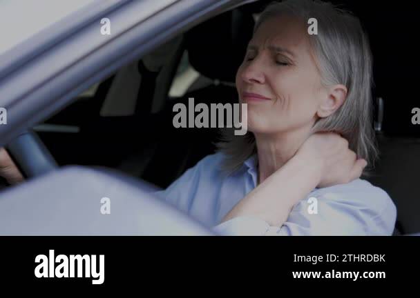 Neck injury driving Stock Videos & Footage - HD and 4K Video Clips - Alamy