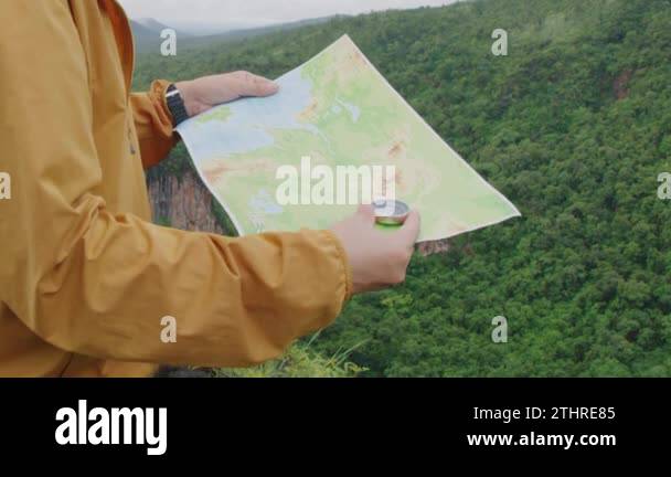 Checking position with map Stock Videos & Footage - HD and 4K Video ...