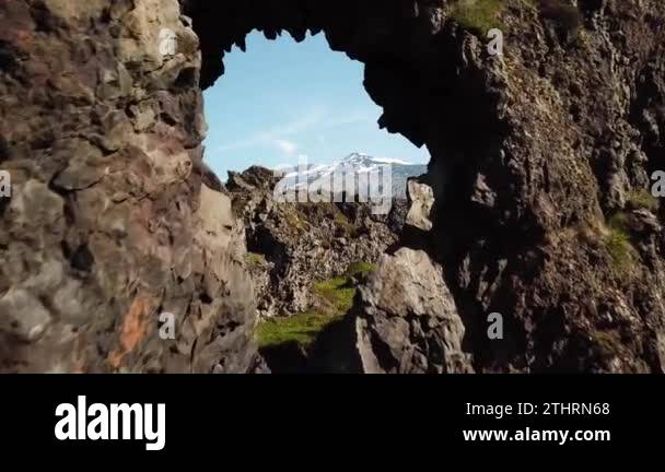 Flying through a window in the rock. Snaefellsjokull glacier in the ...
