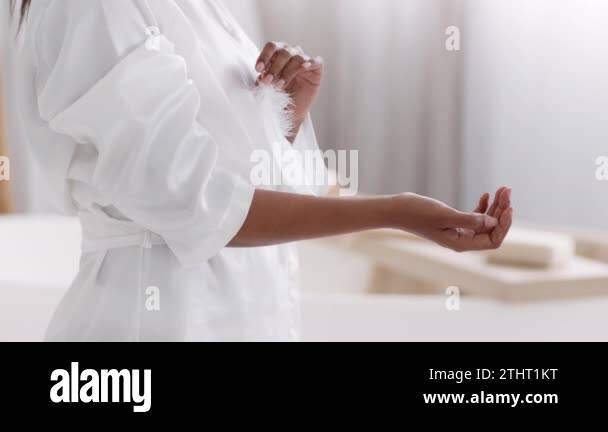 Skin softness. Side view of unrecognizable black woman caressing her ...