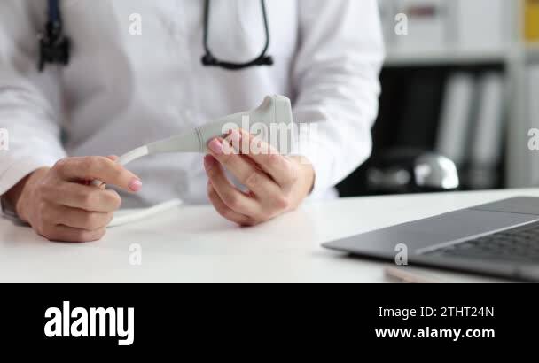 Doctor prepares ultrasound machine for diagnosing patient internal ...