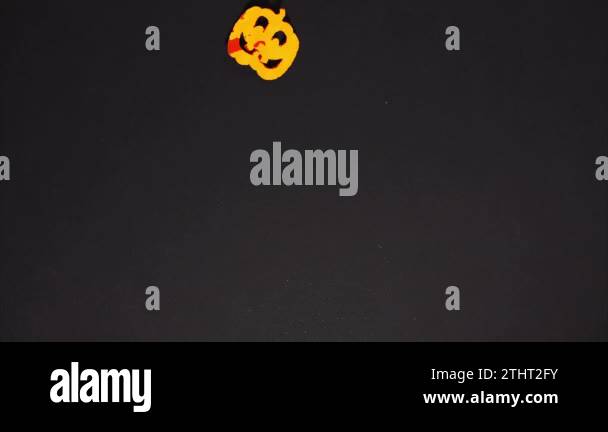 Stop motion animation Halloween. Funny cute smile felt cartoon pumpkin ...