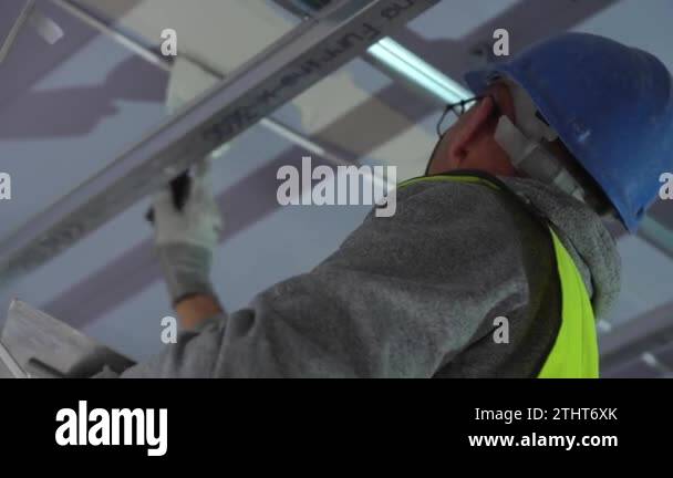 Hard male work on construction site. professional worker in special ...