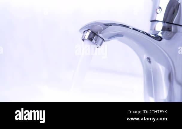 Water tap, stainless steel faucet in 4K VIDEO. Water flow in bathroom ...