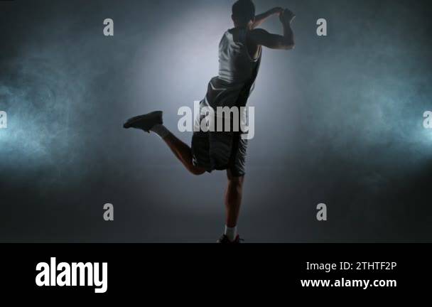 Super slow motion of basketball player running and scoring. Filmed on ...