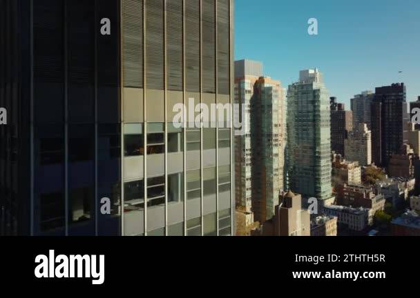 Slide and pan footage of high rise apartment buildings in midtown ...
