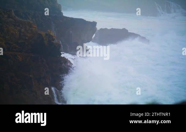 Powerful waves breaking cliff making explosion. Closeup dramatic ocean ...