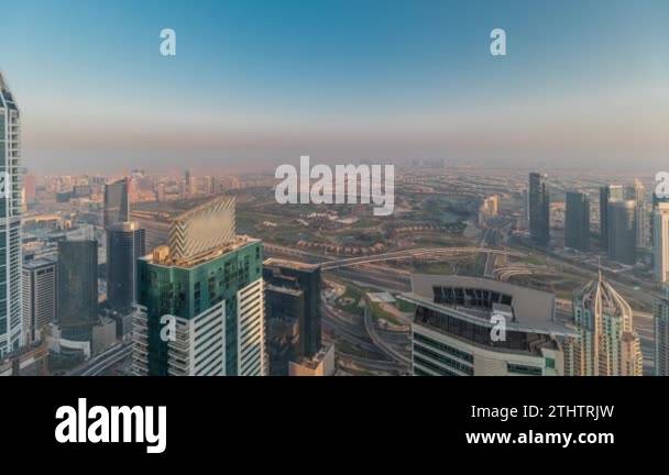 Panorama of Dubai Marina with JLT skyscrapers and golf course timelapse ...