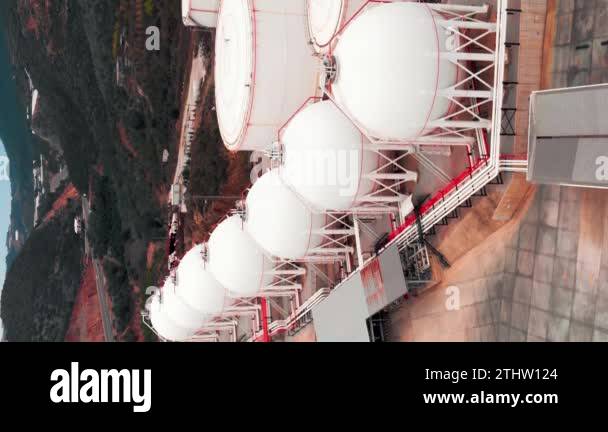 Fuel tanks on factory. Vertical video. Liquefied gas and oil products ...