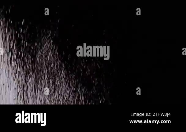 Stream Falling Particles, Sparks, Dust, Debris, Powder on Black ...