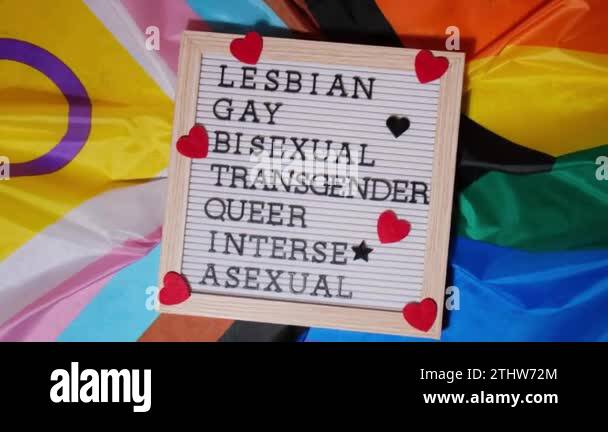 LGBTQIA description frame on Rainbow LGBTQIA flag made from silk ...