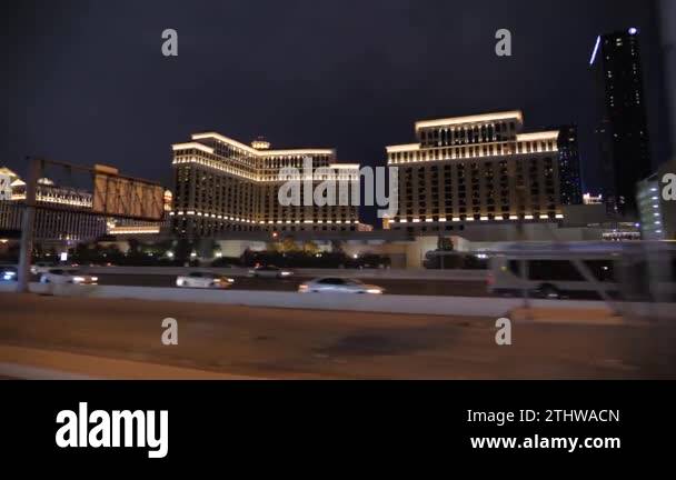 Night in Las Vegas USA, Freeway Traffic With Caesars Palace Hotel and Casino Buildings Back View ...