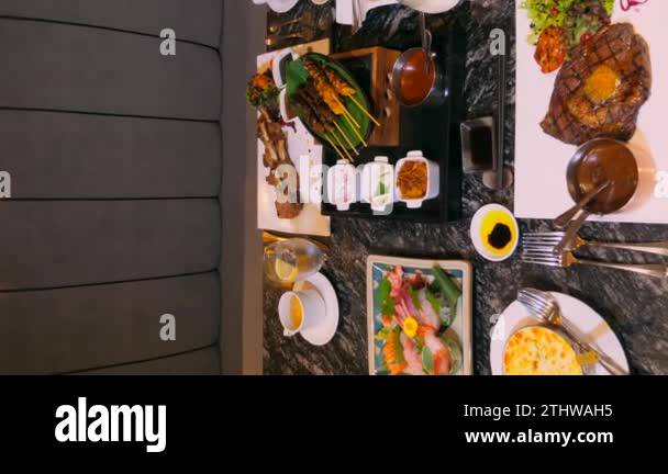 Enjoy fine food dining in luxury restaurant with table full of food ...