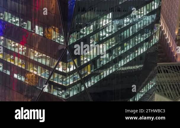 Windows in high-rise office tower exterior in the late evening with ...