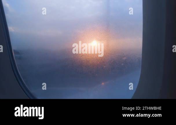 Airplane window with condensation at the sunset Stock Video Footage - Alamy