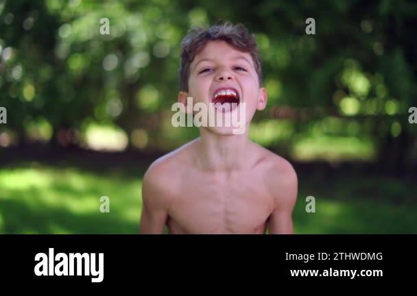 Child boy screaming from top of his lungs in slow-motion 120fps. Kid ...