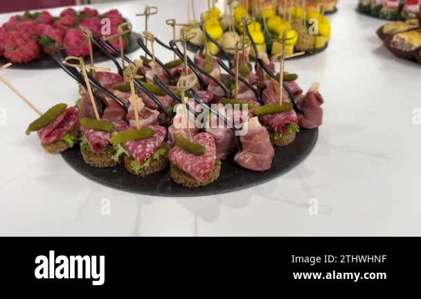 Light snacks canapes gherkins with salami and Philadelphia cream cheese ...