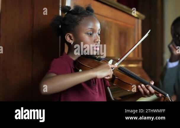 Girl playing fiddle Stock Videos & Footage - HD and 4K Video Clips - Alamy