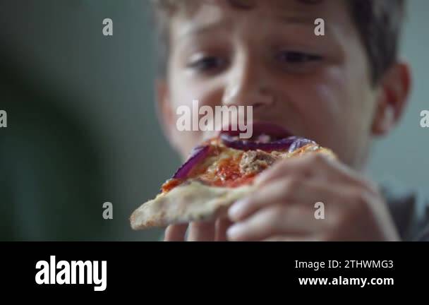 Kid eating pizza Stock Videos & Footage - HD and 4K Video Clips - Alamy