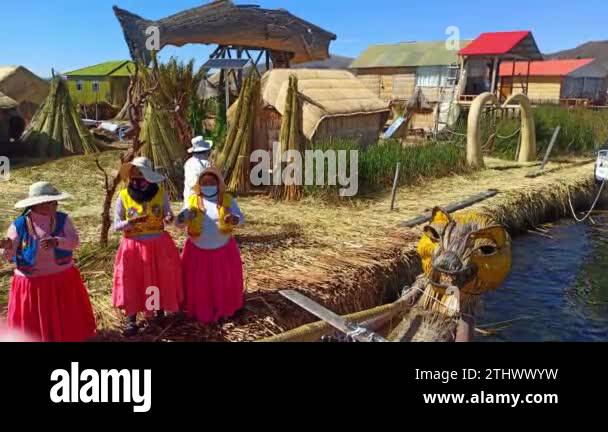 Uros indian woman in traditional reed boat Stock Videos & Footage - HD ...
