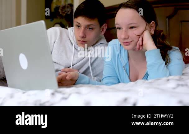 online learning teenagers boy and girl sitting near laptop and doing ...
