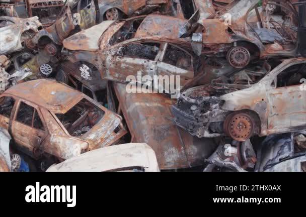 This stock video shows a dump of shot and burned cars in Irpin, Bucha ...