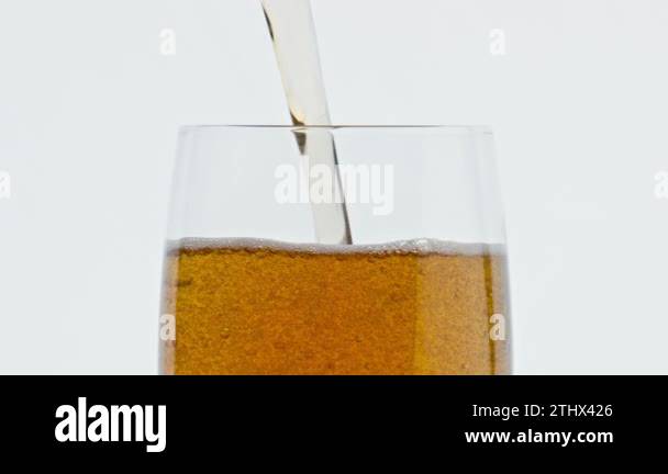 Refreshing beer pouring glass closeup slow motion. Alcoholic hoppy ...