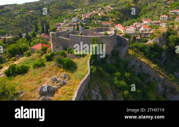 This aerial stock video captures the stunning ruins of the Old Bar or ...