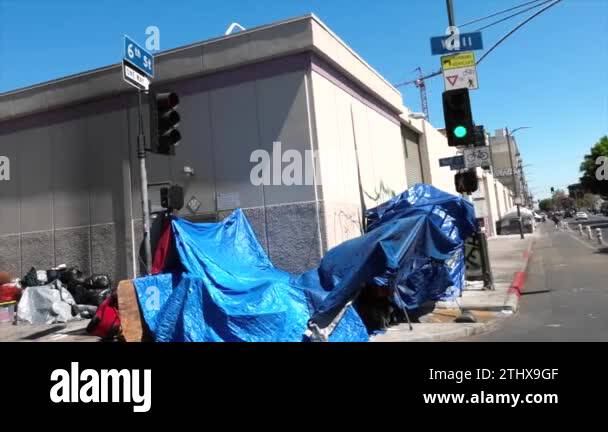 Homeless people on skid row in Los Angeles, California use tarps and ...