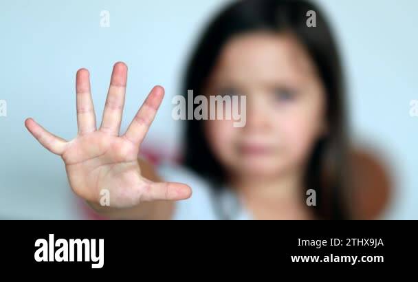 Little girl stop sign with hand, saying no, expressing defense or ...