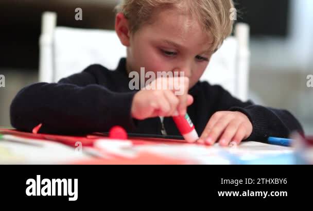 Boy gluing paper Stock Videos & Footage - HD and 4K Video Clips - Alamy