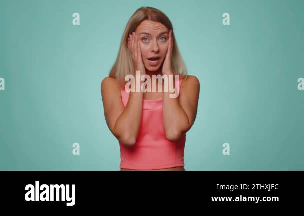 Oh my God, Wow. Excited amazed winner woman raising hands in surprise ...