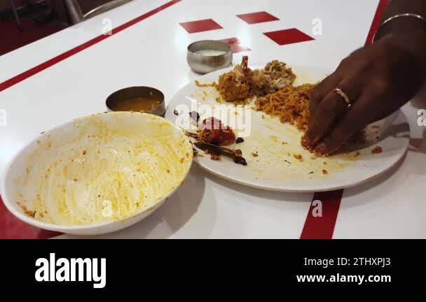 Man finishes eating Indian popular food chicken biriyani served with ...