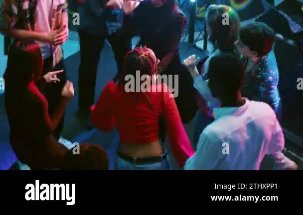 Multiple people dancing at nightclub, having fun together on dance ...