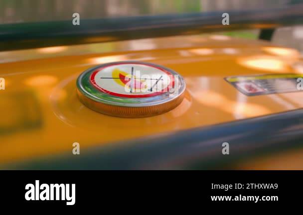 Filler cap of an orange gas tank close-up. Flammable hazardous material ...