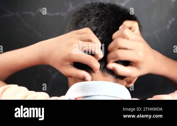 teenage boy Scratching Head Against black background Stock Video ...
