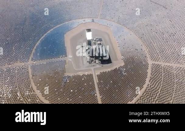 Drone footage of sunbeams focusing onto the tower with modern panels ...