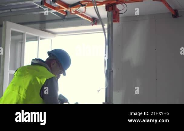 Hard male work on construction site. Two professional workers in ...
