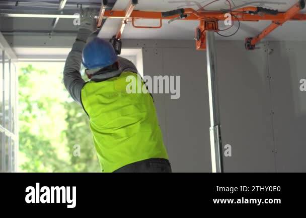 Hard male work on construction site. Two professional workers in ...
